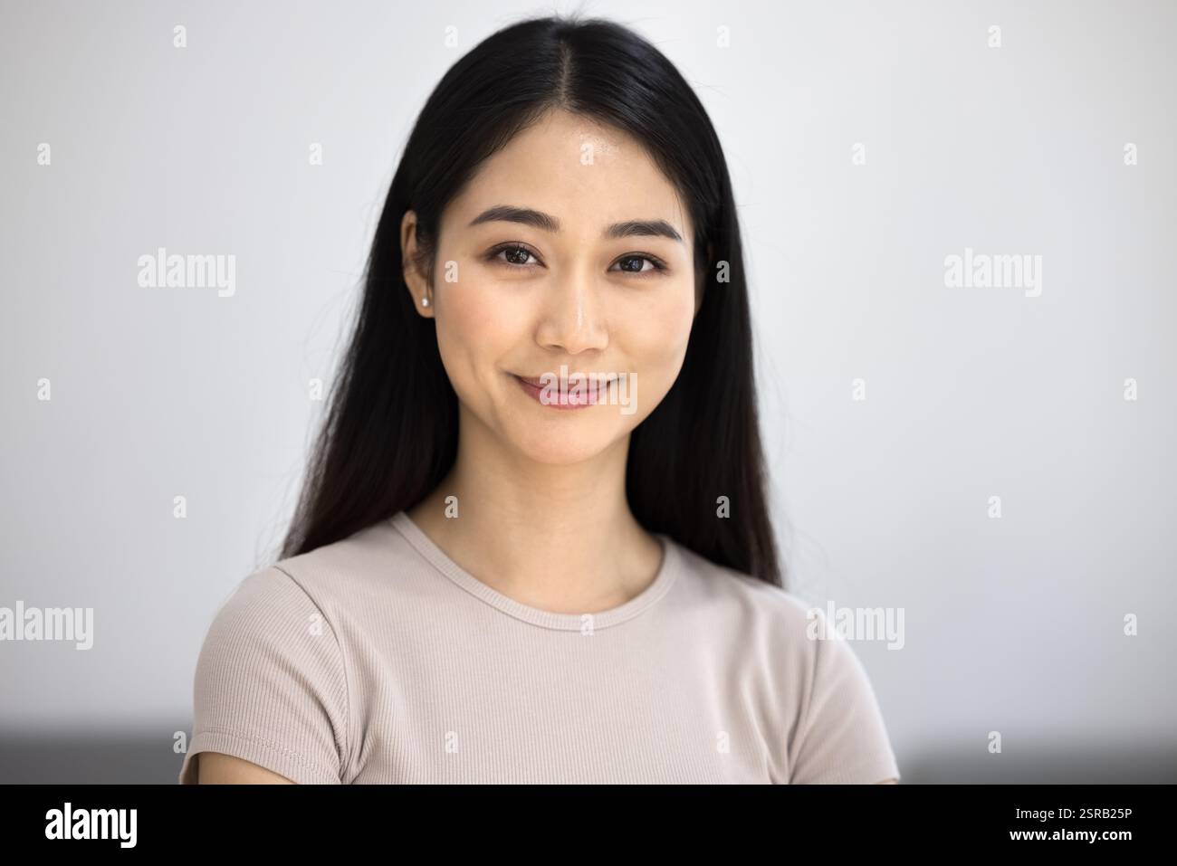 Headshot portrait Asian woman with gentle smile looking at camera Stock ...
