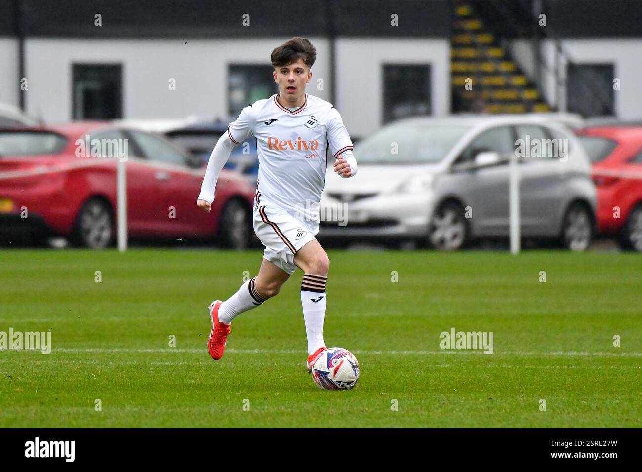Landore, Swansea, Wales. 15 February 2025. Alex Godfrey of Swansea City on the ball during the ...