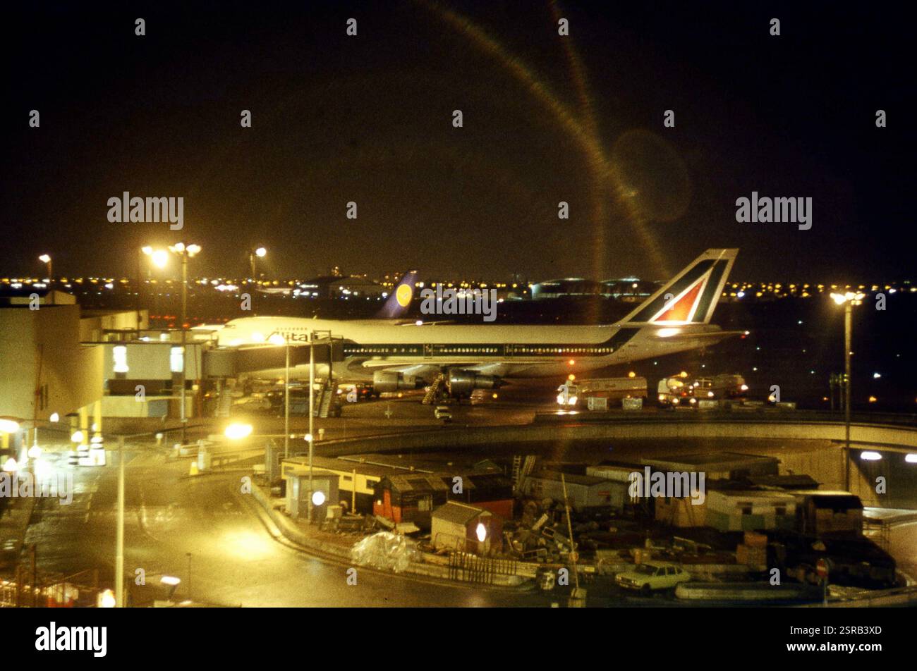 I-DEMB Alitalia Boeing 747-243B in a London Heathrow night scene Stock ...