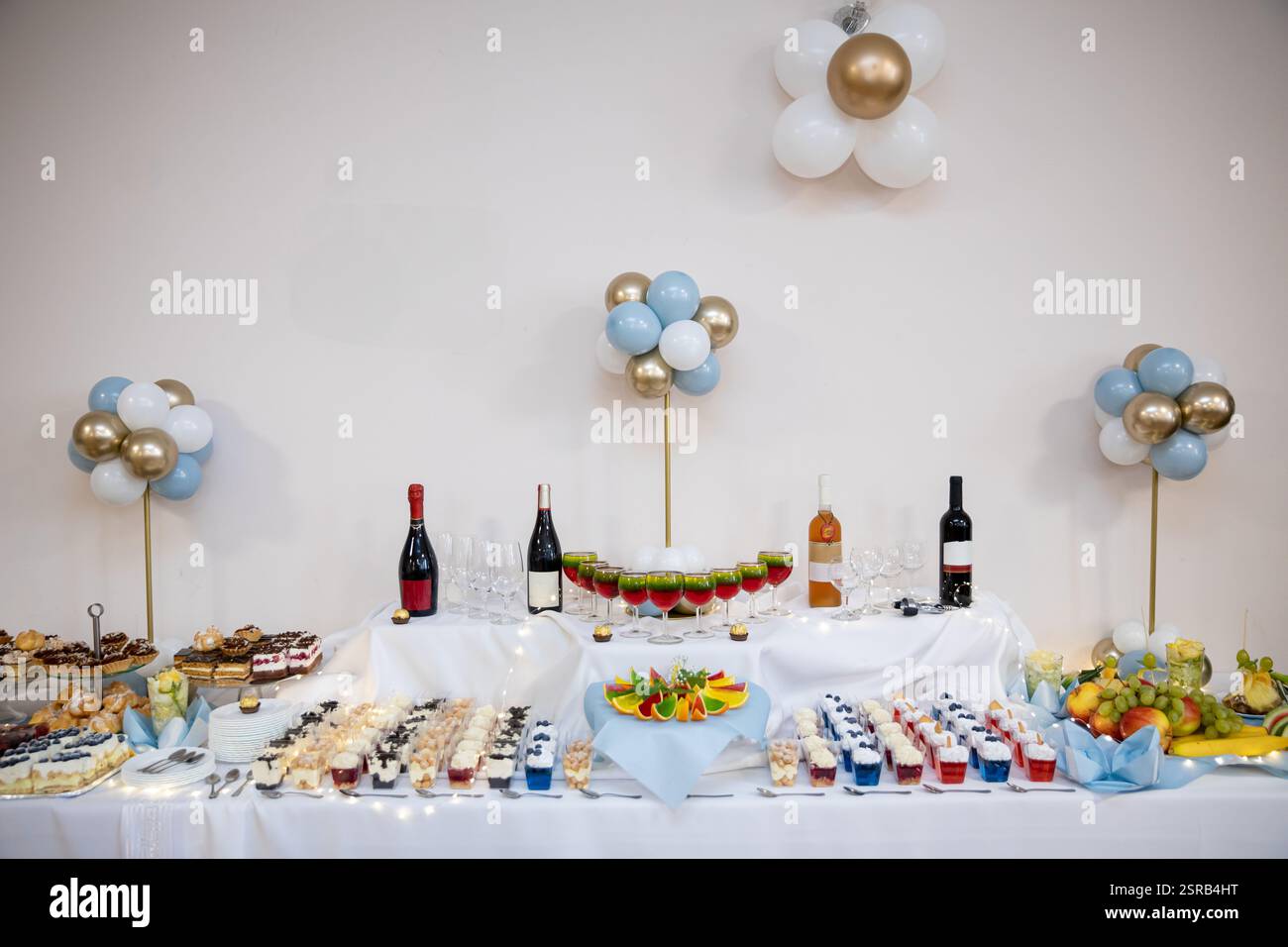 An Elegant Party Table Setup Featuring an Array of Delicious Treats ...