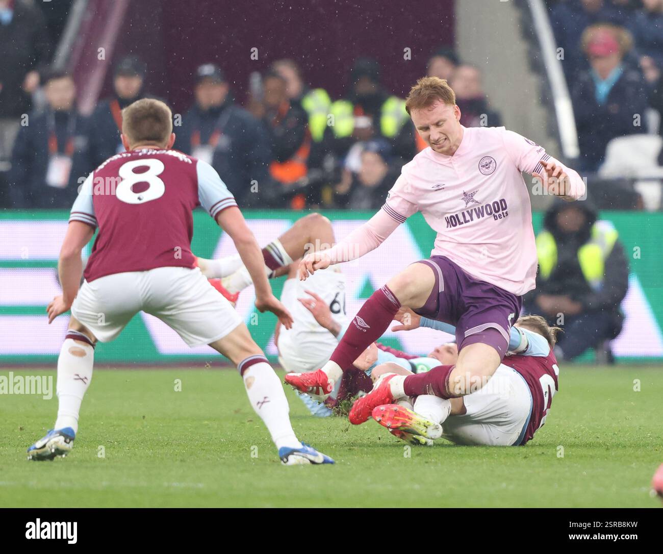 London, UK. 15th Feb, 2025. Jarrod Bowen (WHU) Sepp Van den Berg (B) at the West Ham United v ...