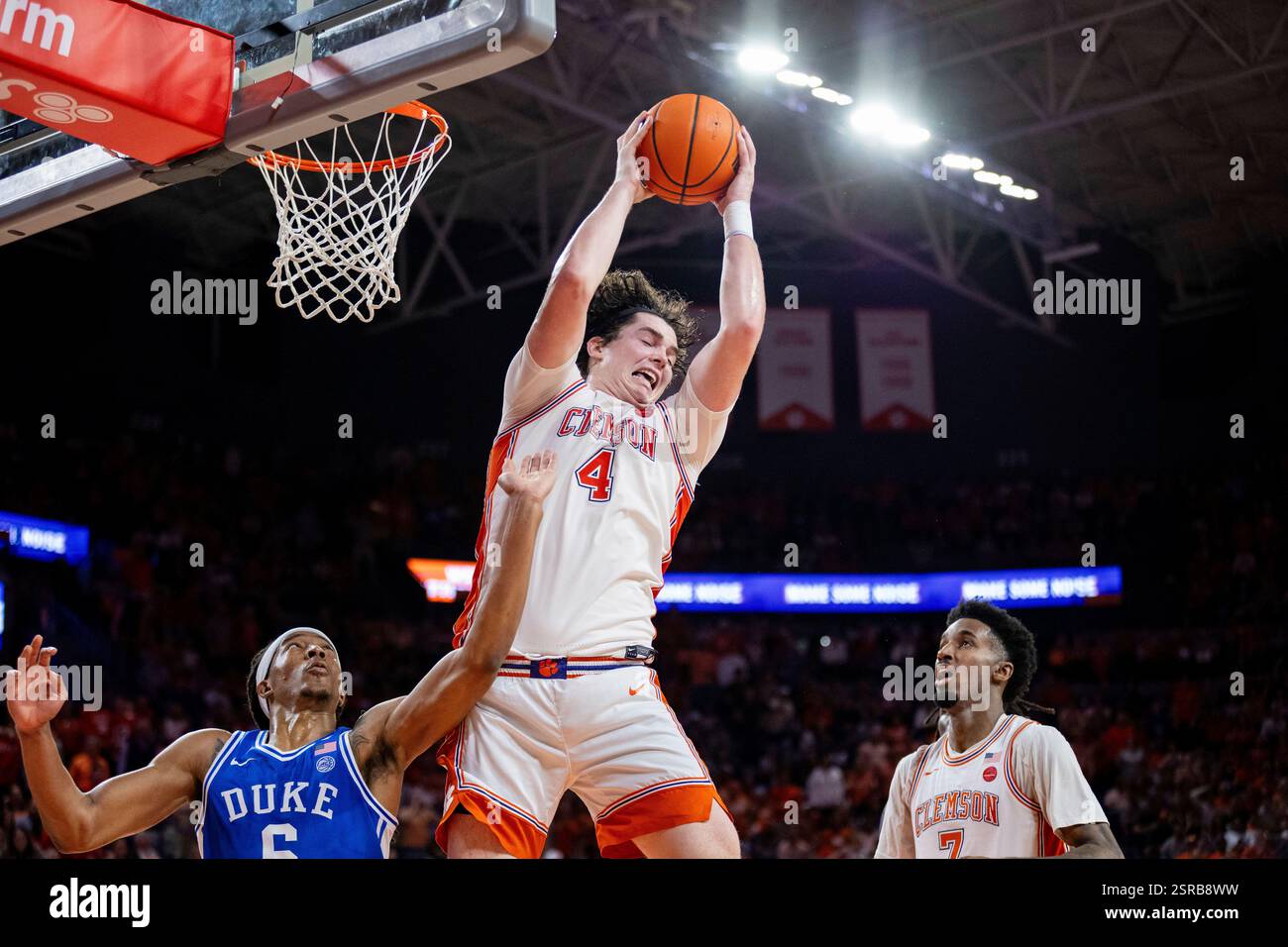 Clemson forward Ian Schieffelin (4) grabs a rebound over Duke forward ...