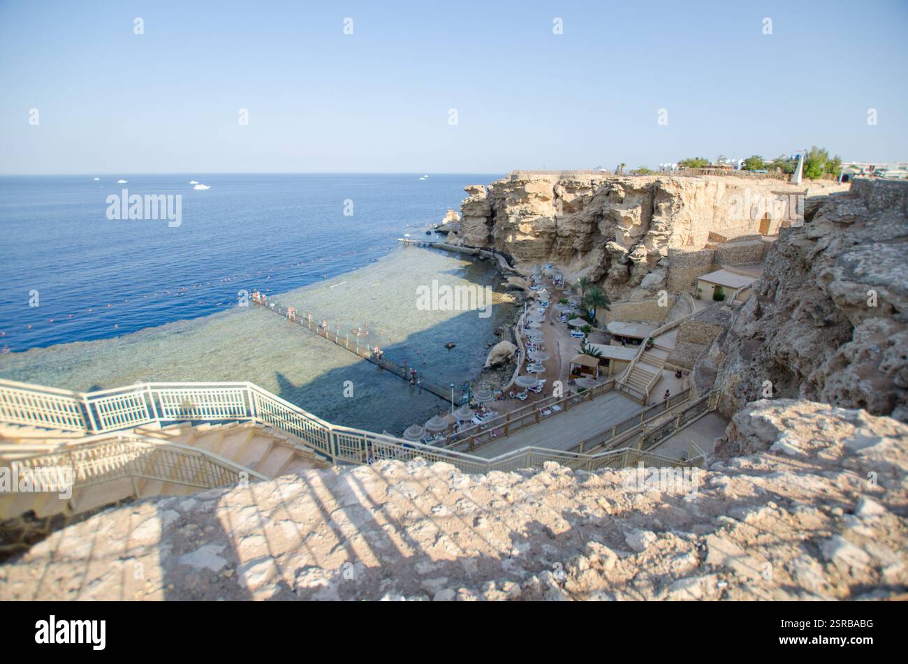 Scenic resort nestled on rocky cliffs, offering stunning sea views ...