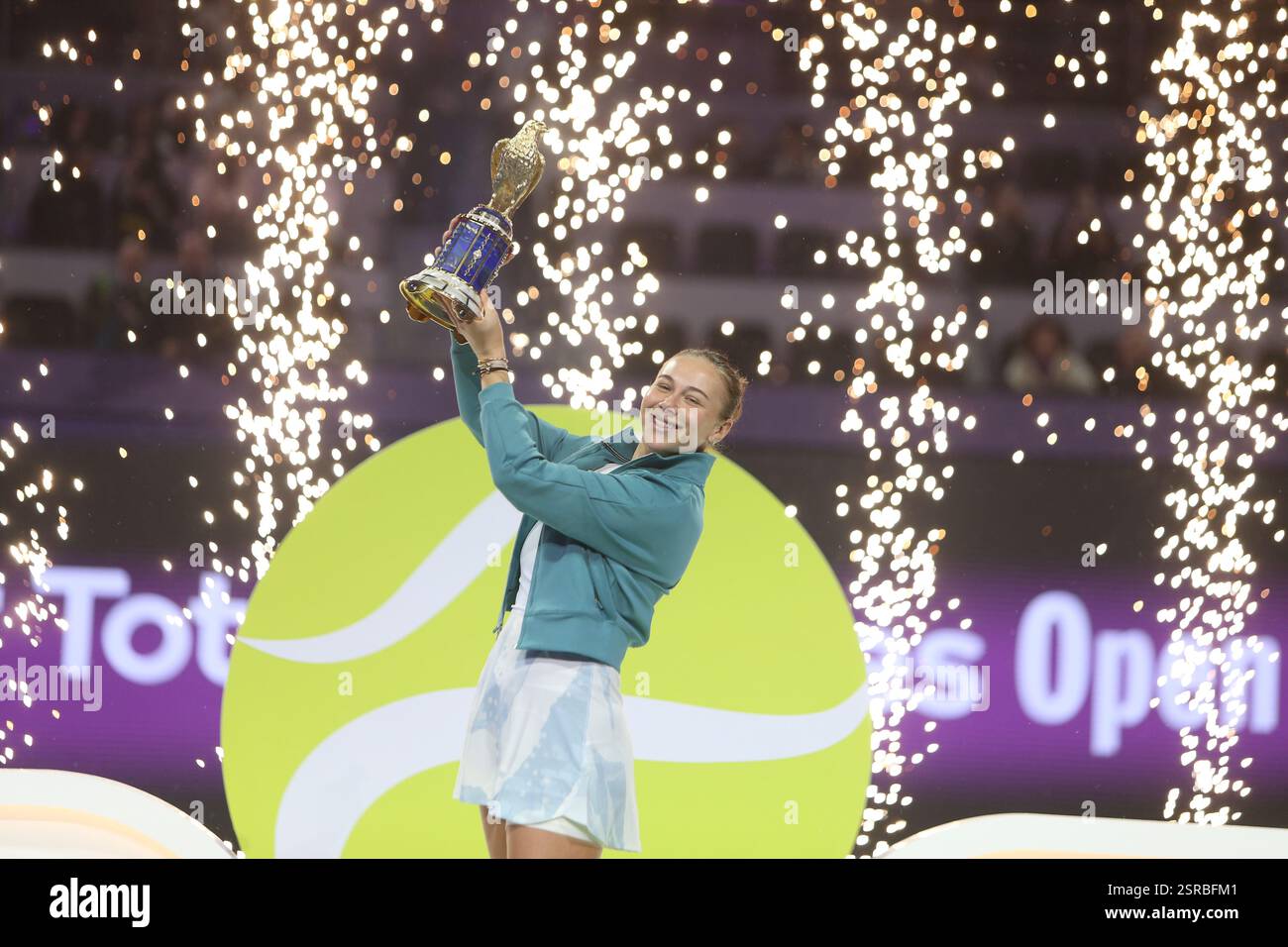 Amanda Anisimova of the United States holds the trophy after winning ...