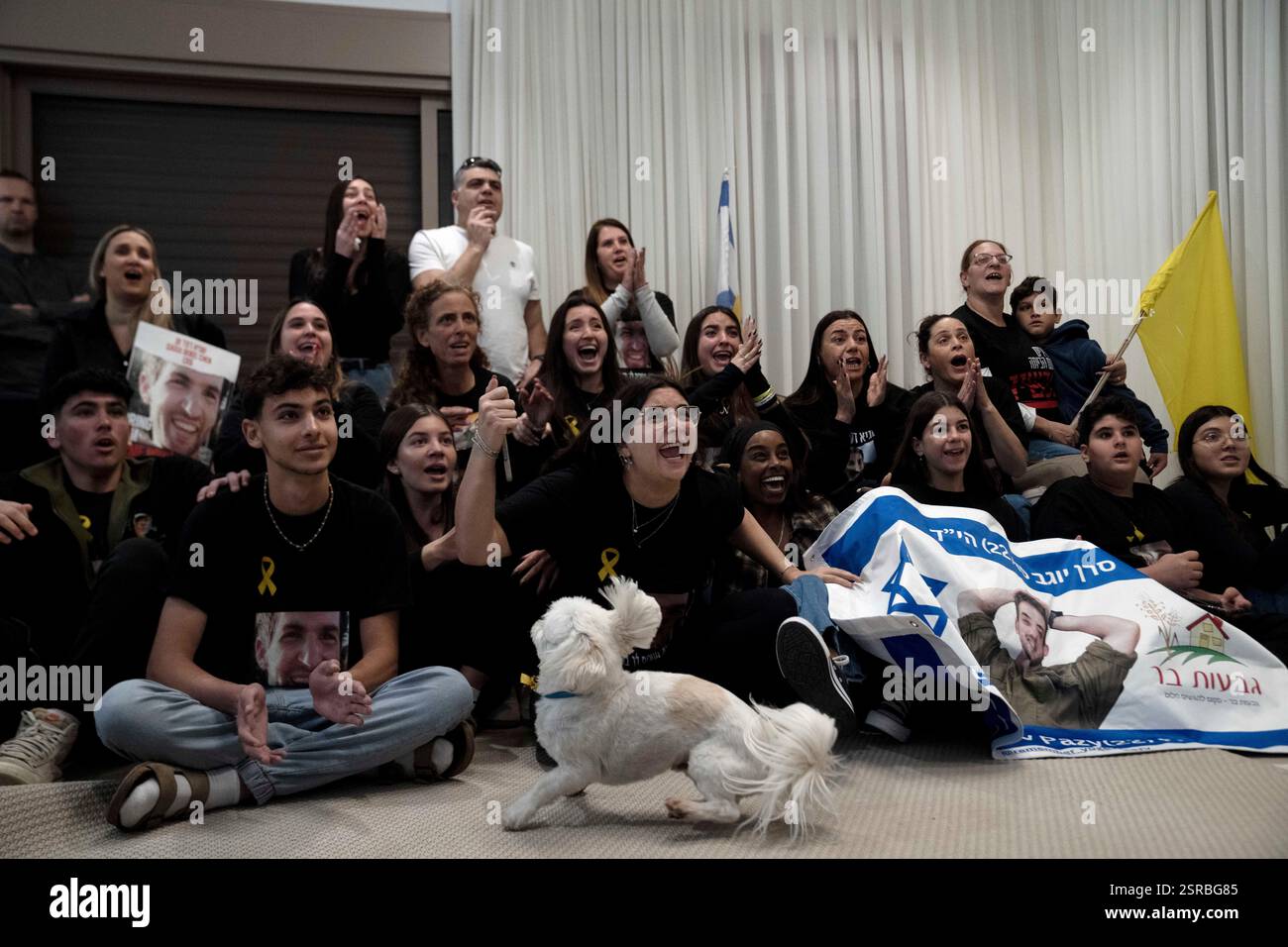 Friends of Sagui Dekel-Chen react as they watch a live Gaza broadcast ...