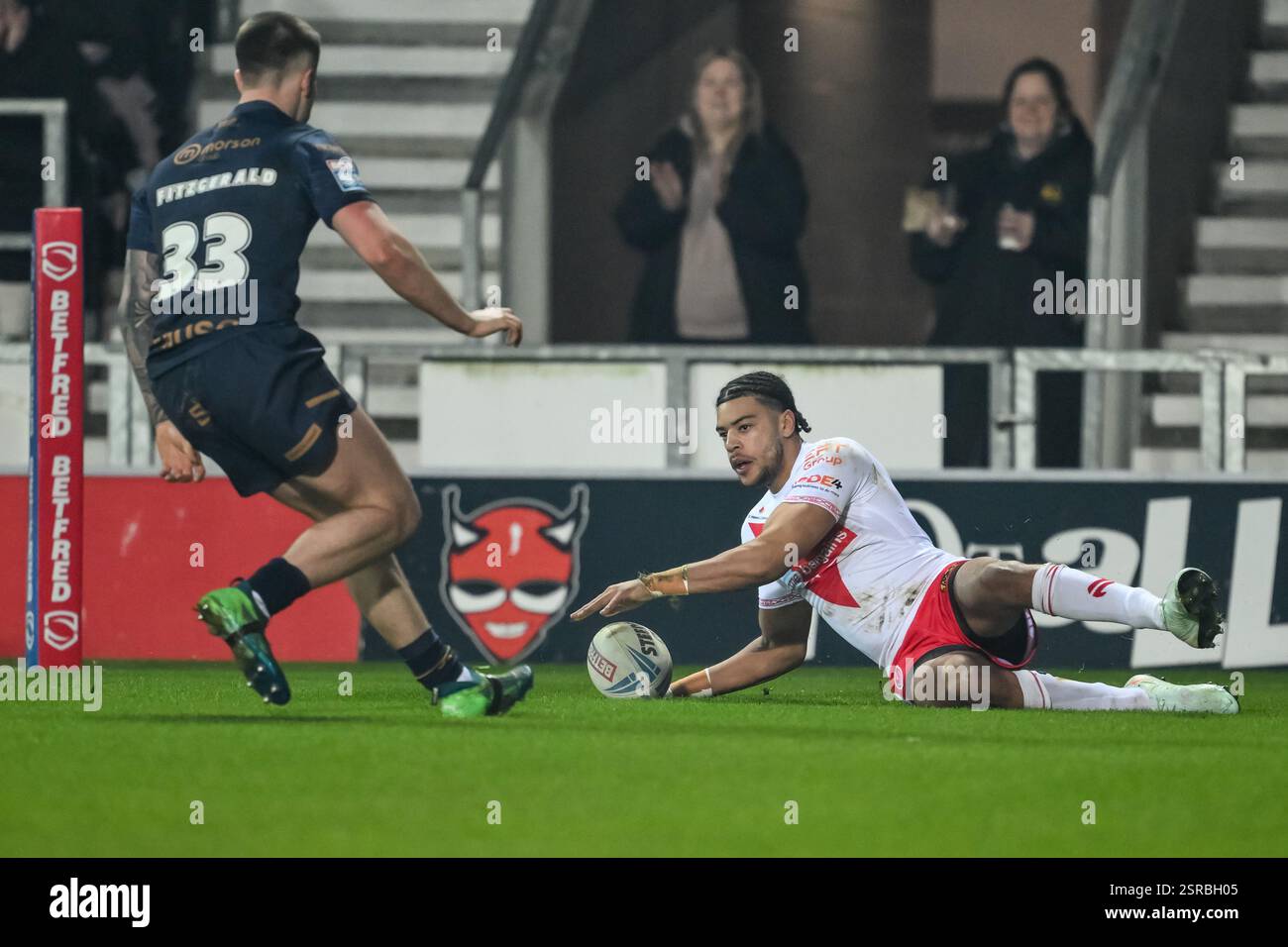 Lewis Murphy of St. Helens goes over for a try during the Betfred Super ...