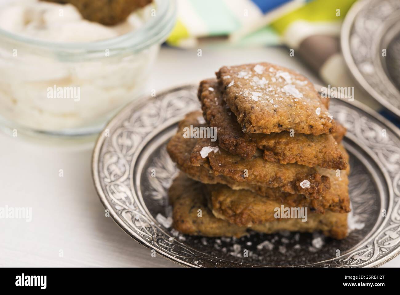 Spanish snack crackers with black olives and anchois Stock Photo - Alamy