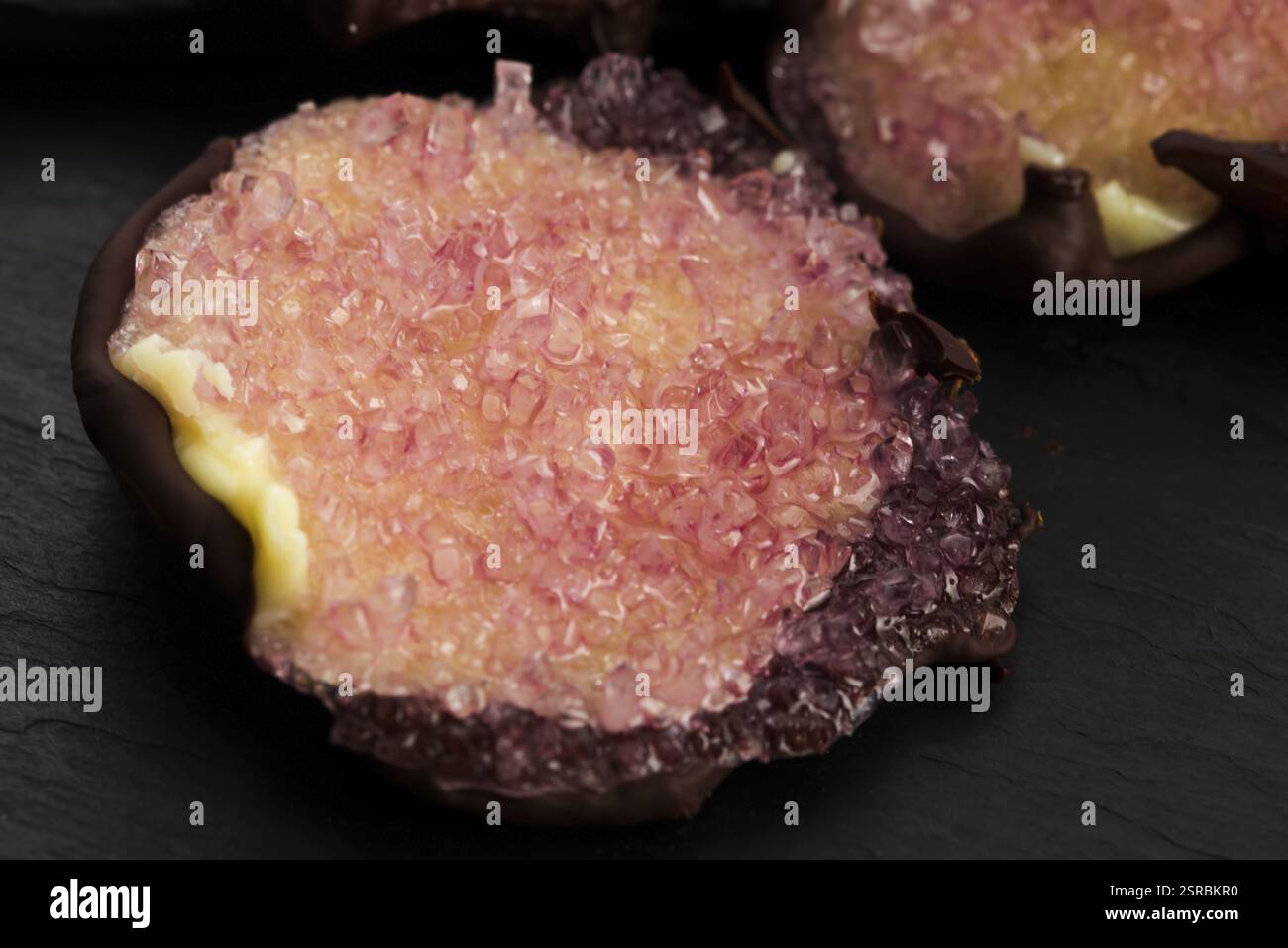 Edible Sugar Crystals on black background Stock Photo - Alamy