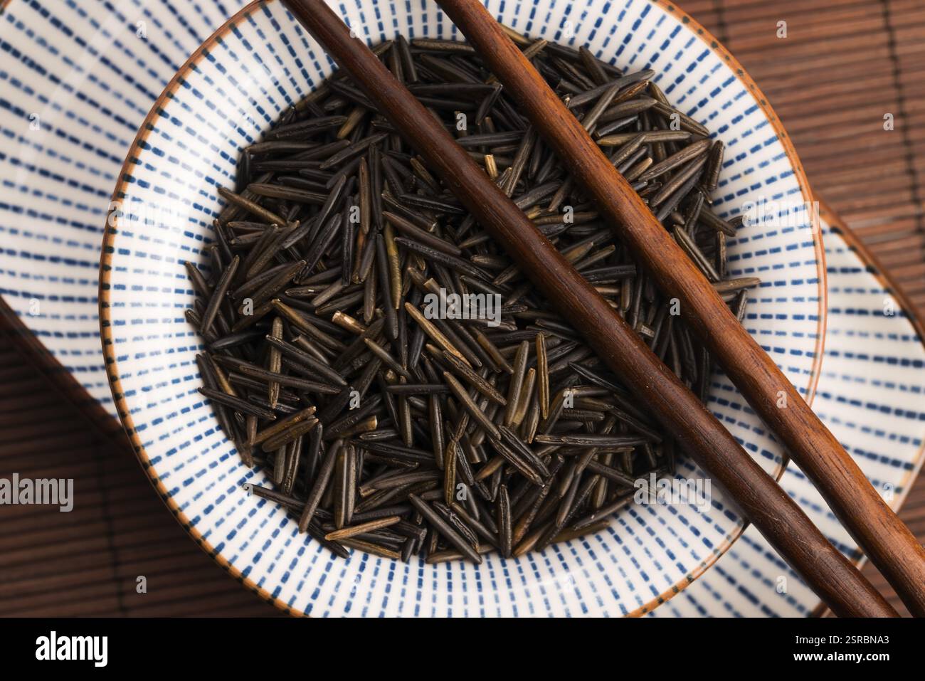 Wild rice in a white ceramic bowl Stock Photo - Alamy