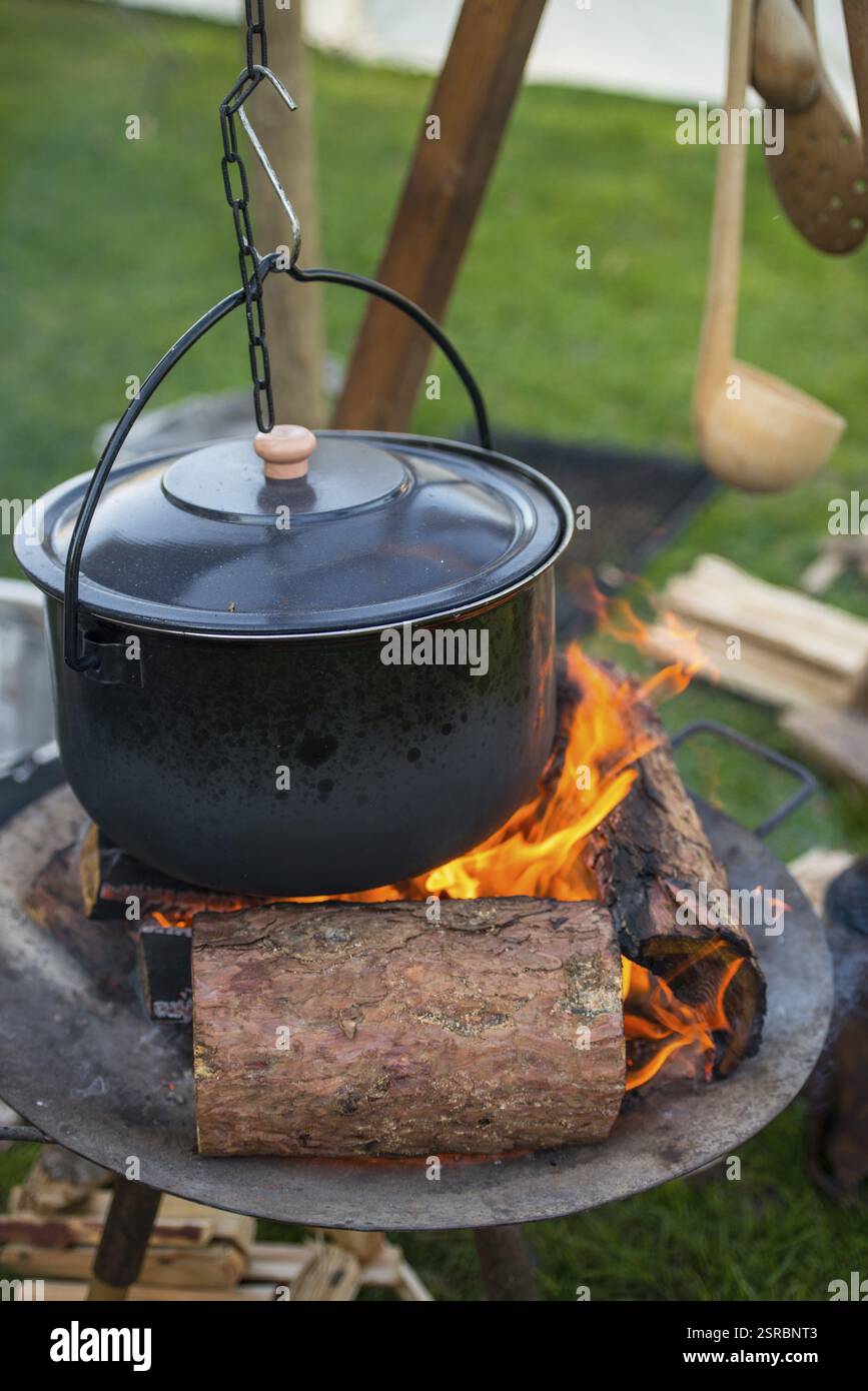 Boiling over the fire Stock Photo - Alamy