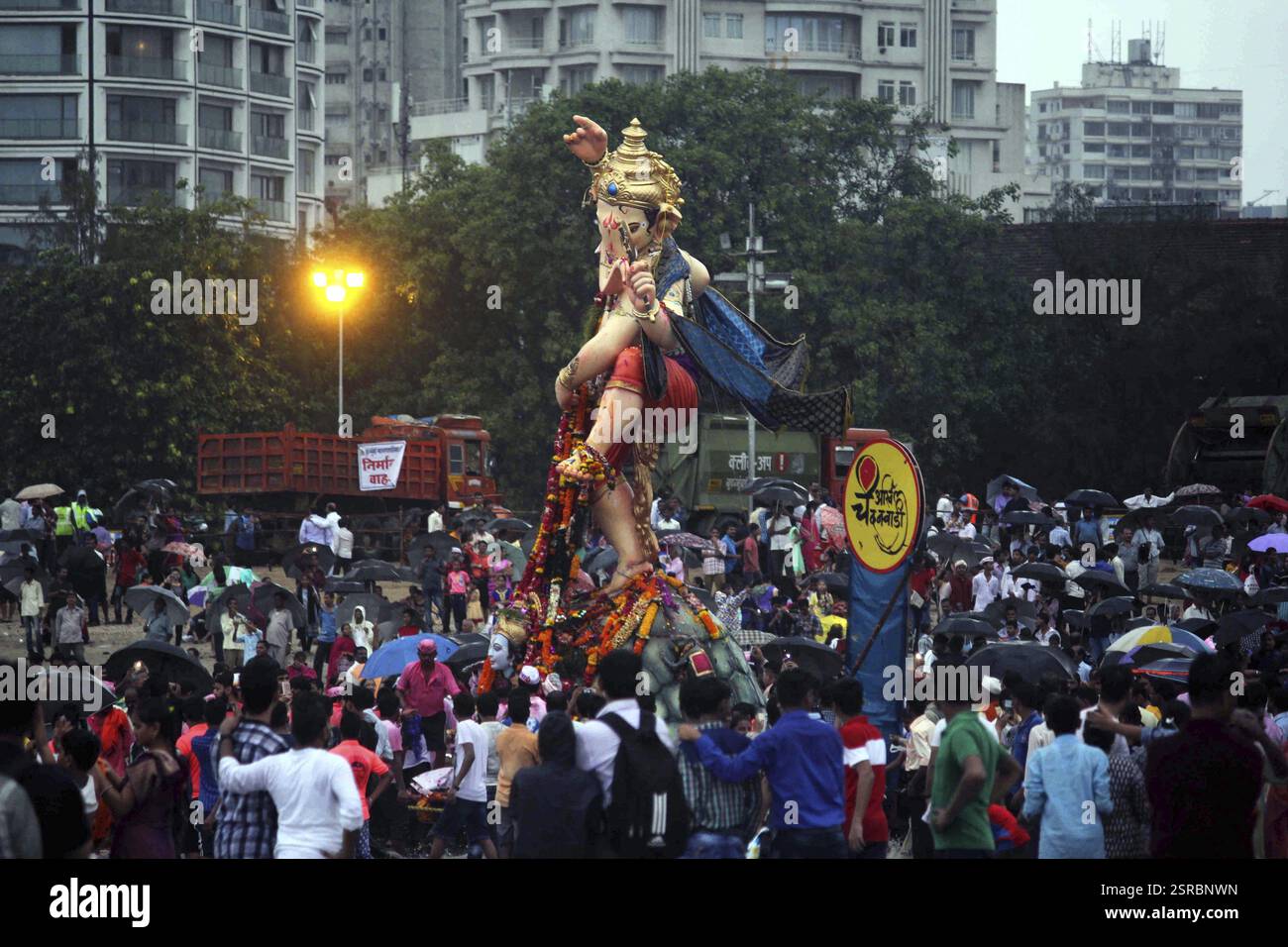 A gigantic idol of Hindu elephant-headed god Ganesh, being led to the ...