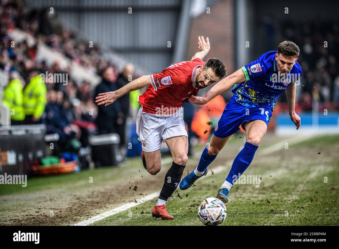 Morecambe FC's Gwion Edwards under pressure from Benn Ward of ...