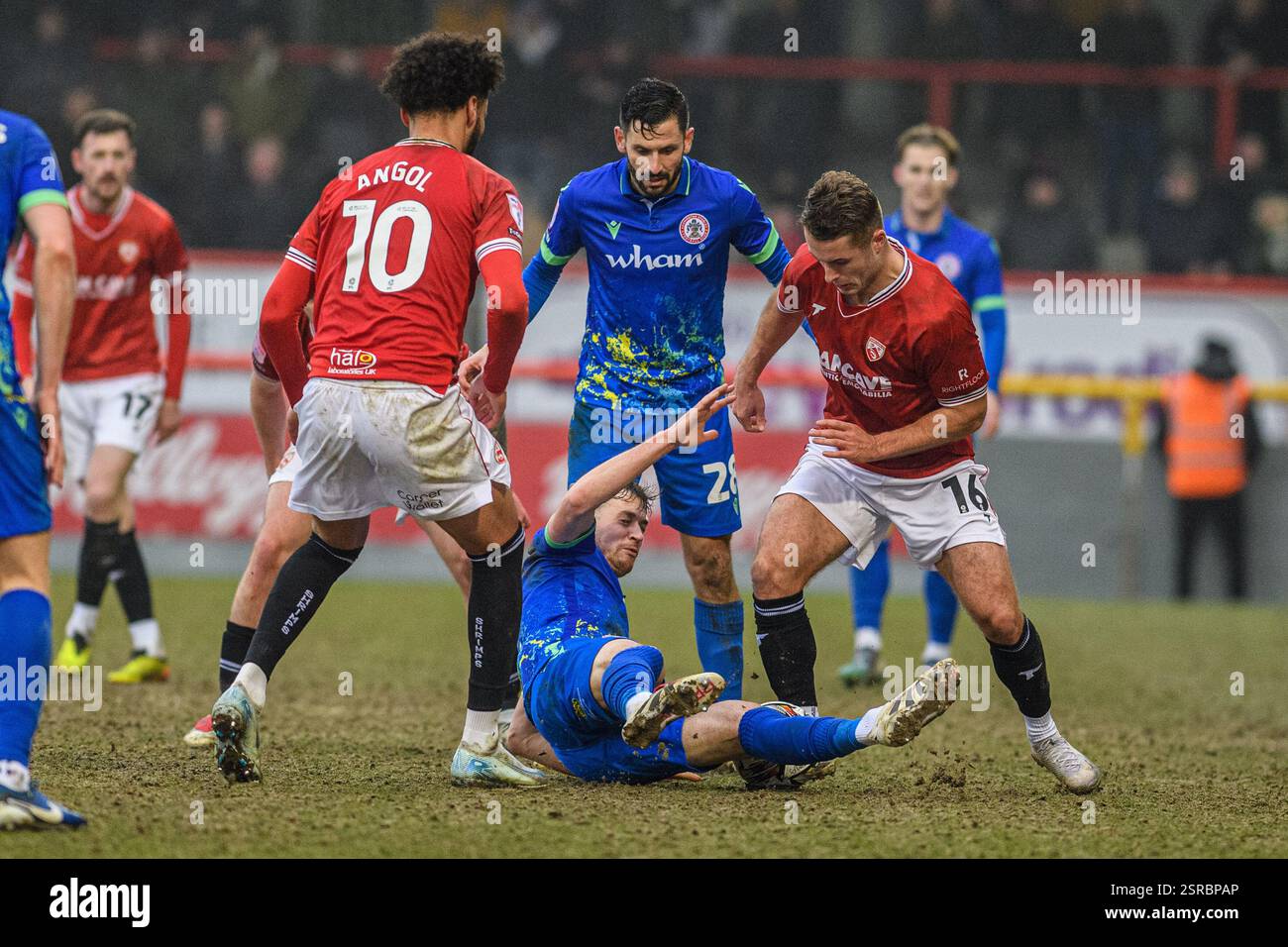 Morecambe FC's Lee Angol and Morecambe FC's Andrew Dallas tackle Donald ...