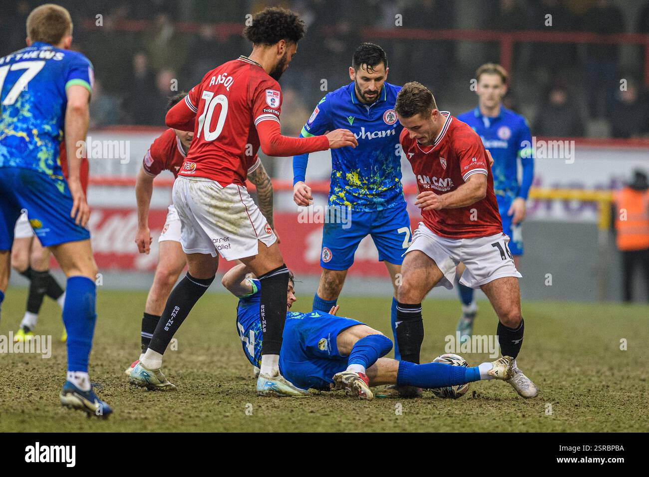 Morecambe FC's Lee Angol and Morecambe FC's Andrew Dallas tackle Donald ...