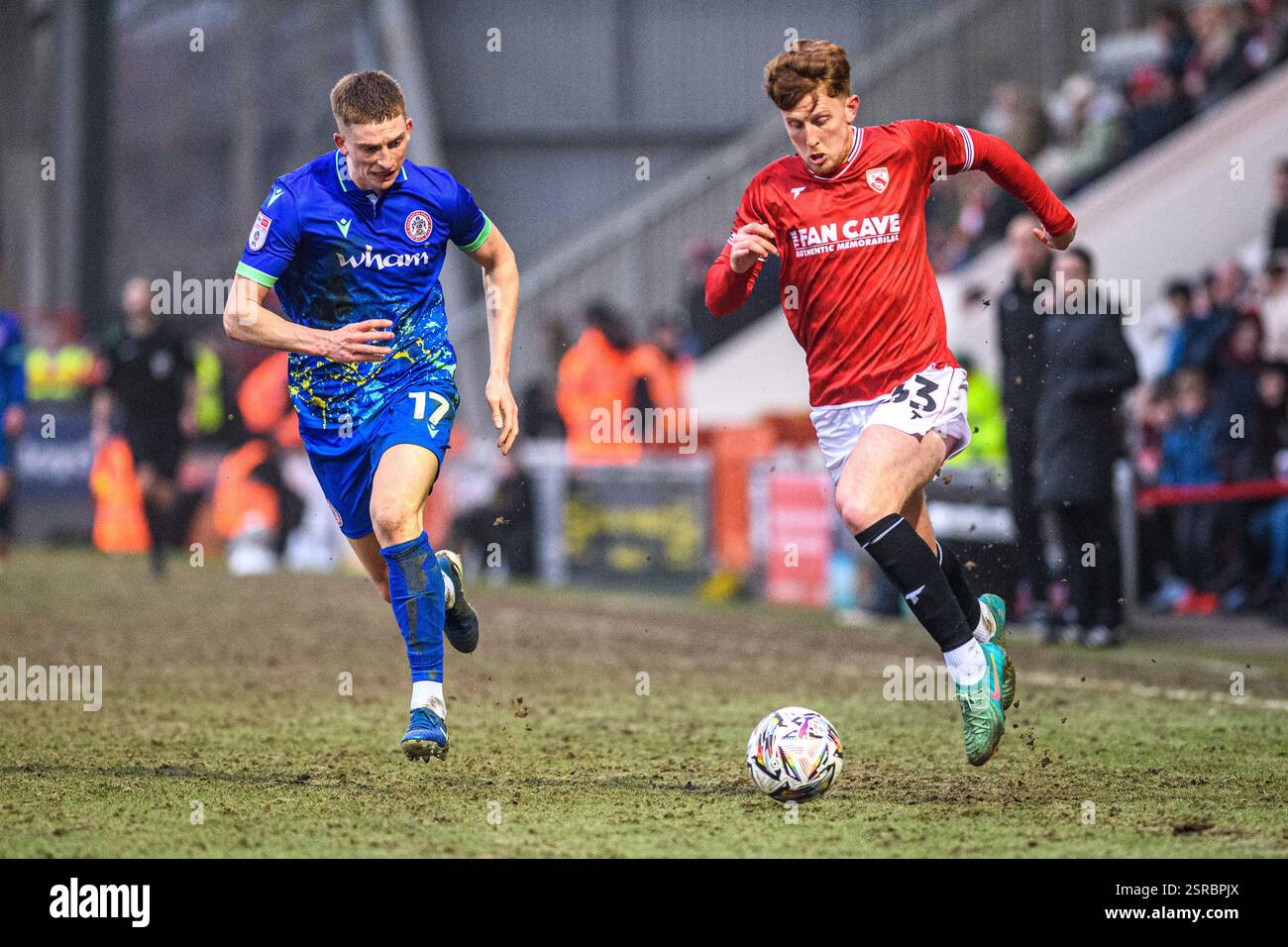 Morecambe FC's Ged Garner makes a run under pressure from Devon ...