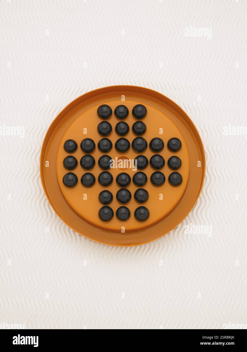 Marble solitaire game India Stock Photo - Alamy