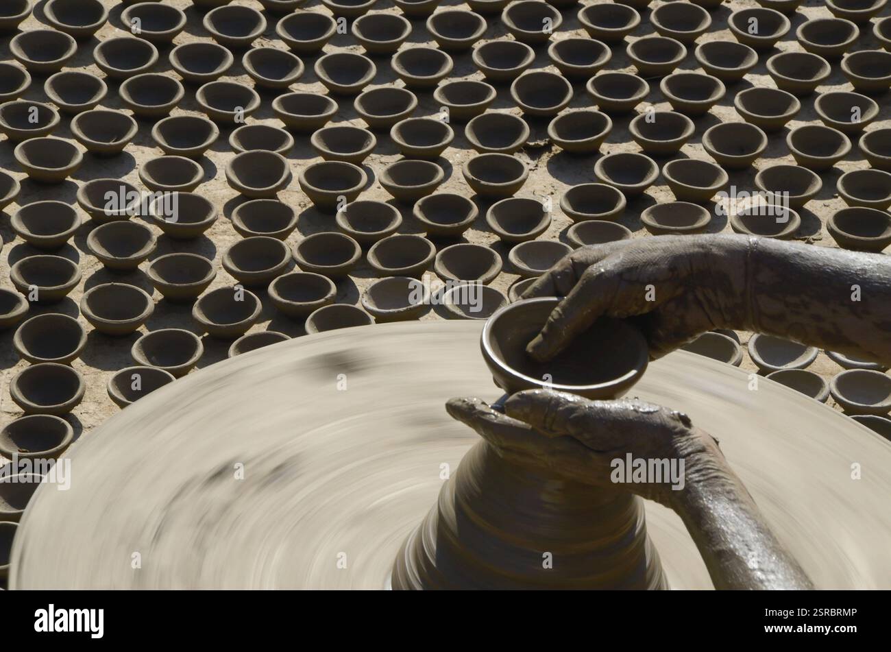 Potter making clay lamps on pottery wheel Jodhpur Rajasthan India Stock ...