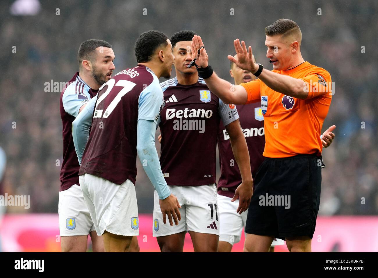 Aston Villa's Morgan Rogers speaks to referee Robert Jones after a ...