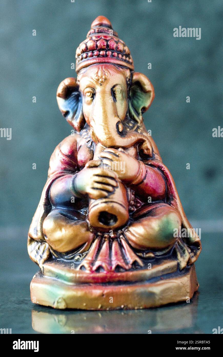 Lord Ganesha ganpati plaster Idol sitting colourful playing trumpet ...