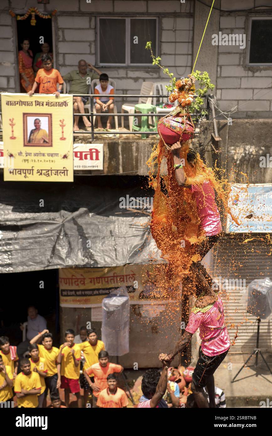 Men human pyramid breaking Dahi Handi, Janmashtami festival, Mumbai ...