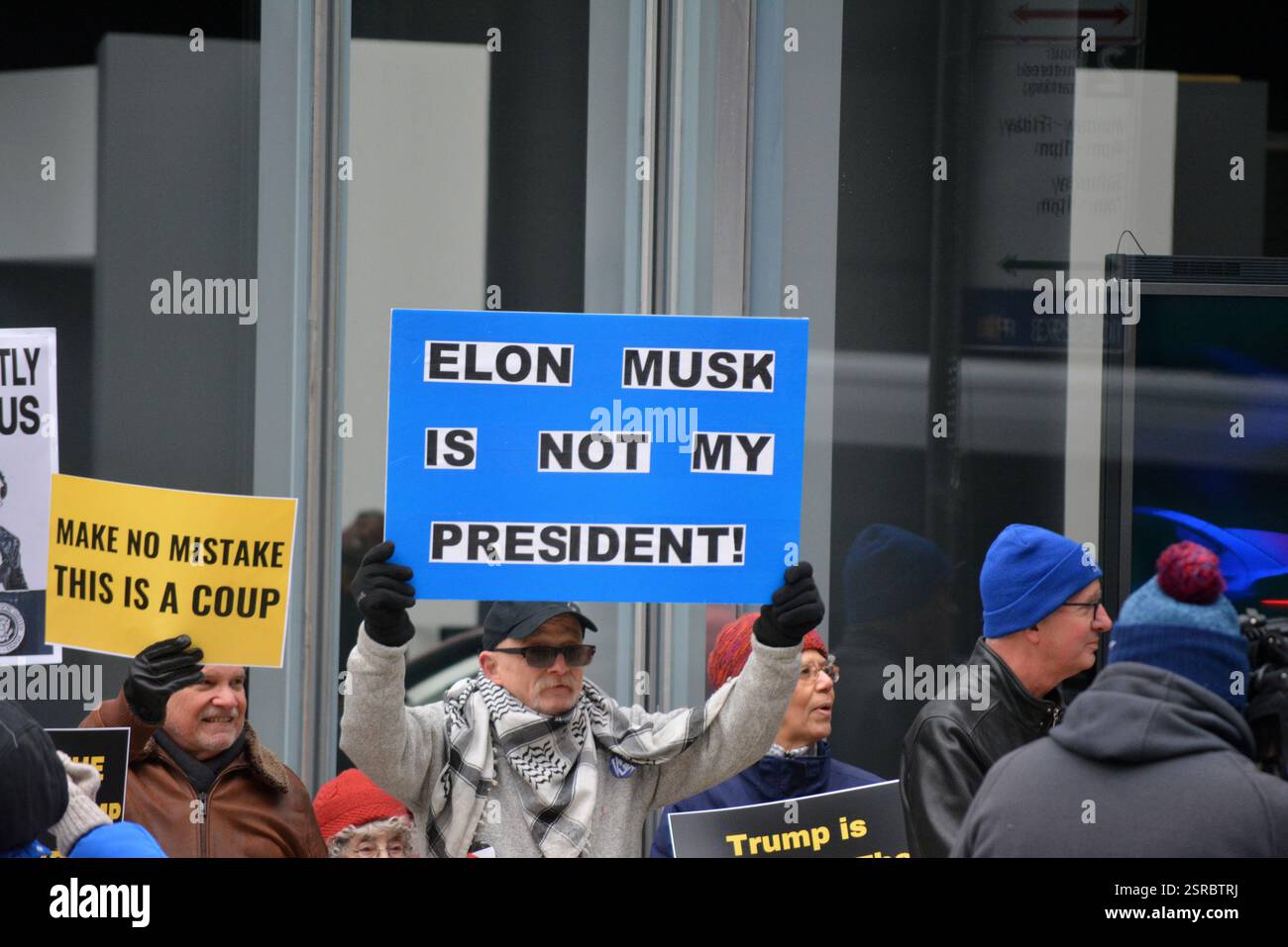 Demonstrators taking part in a "Tesla Takeover" event against Elon Musk ...