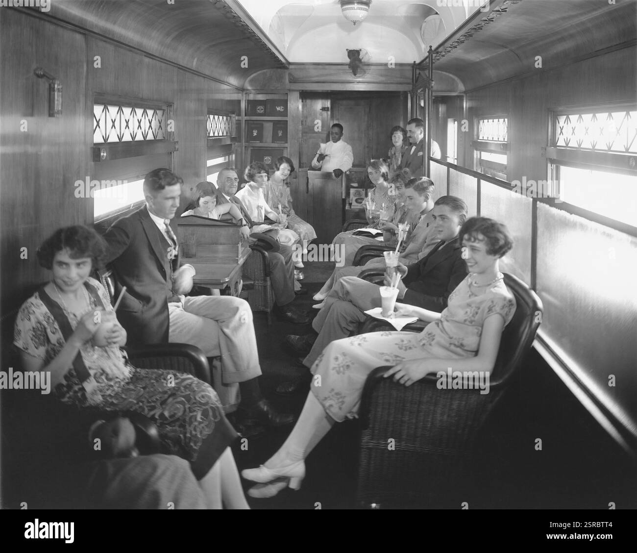 Smiling businessmen sitting in car Black and White Stock Photos ...
