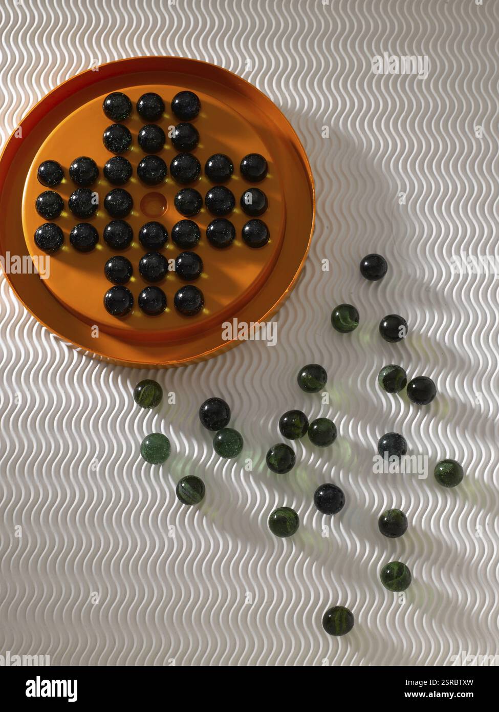 Marble solitaire game India Stock Photo - Alamy