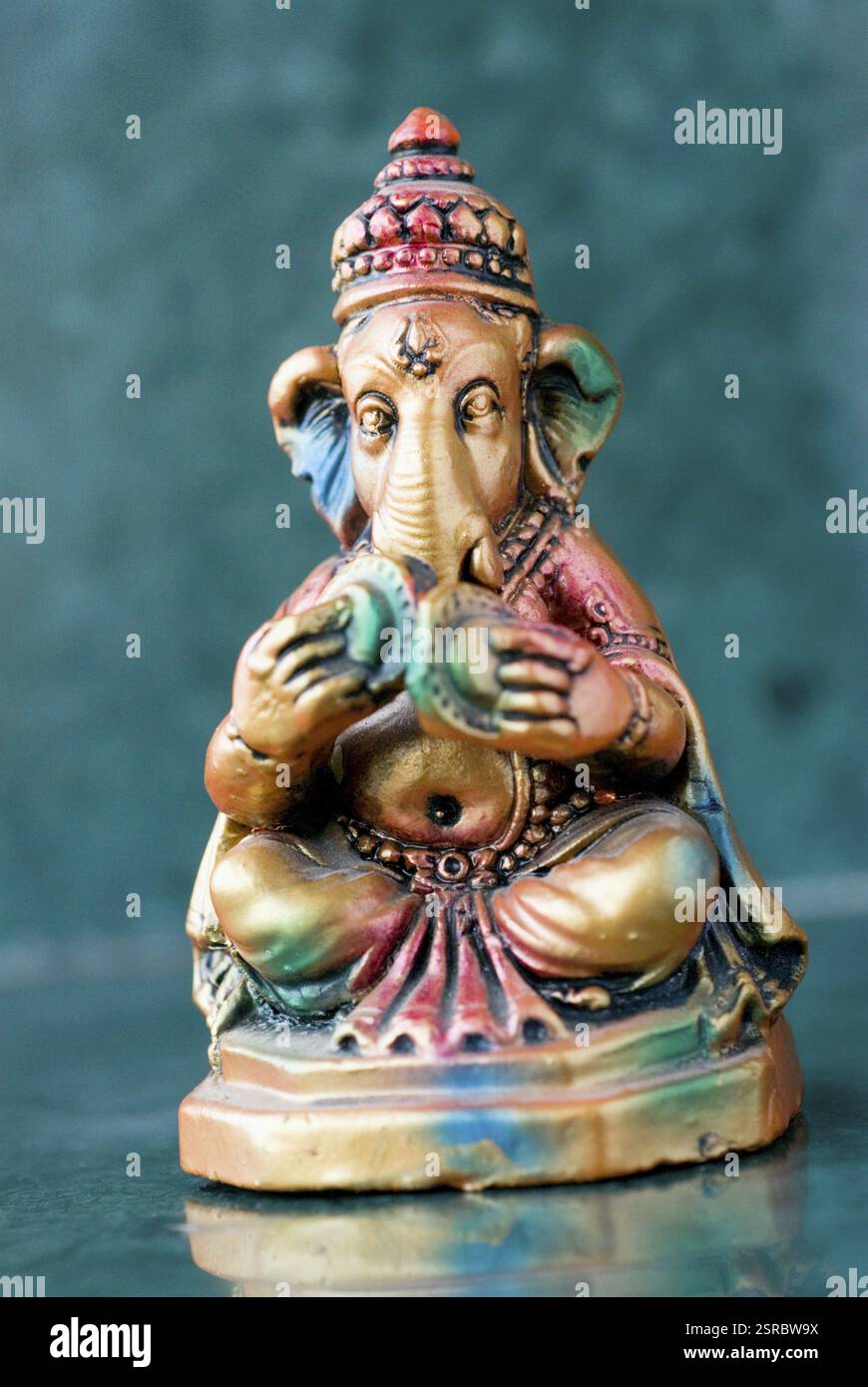 Lord Ganesha ganpati plaster Idol sitting colourful playing pair of ...
