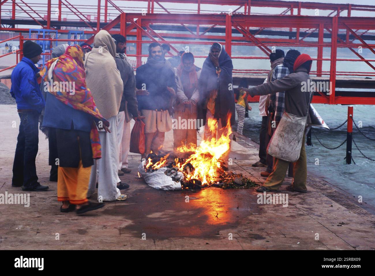 People heating fire at har ki pouri Haridwar, Uttaranchal Uttarakhand ...