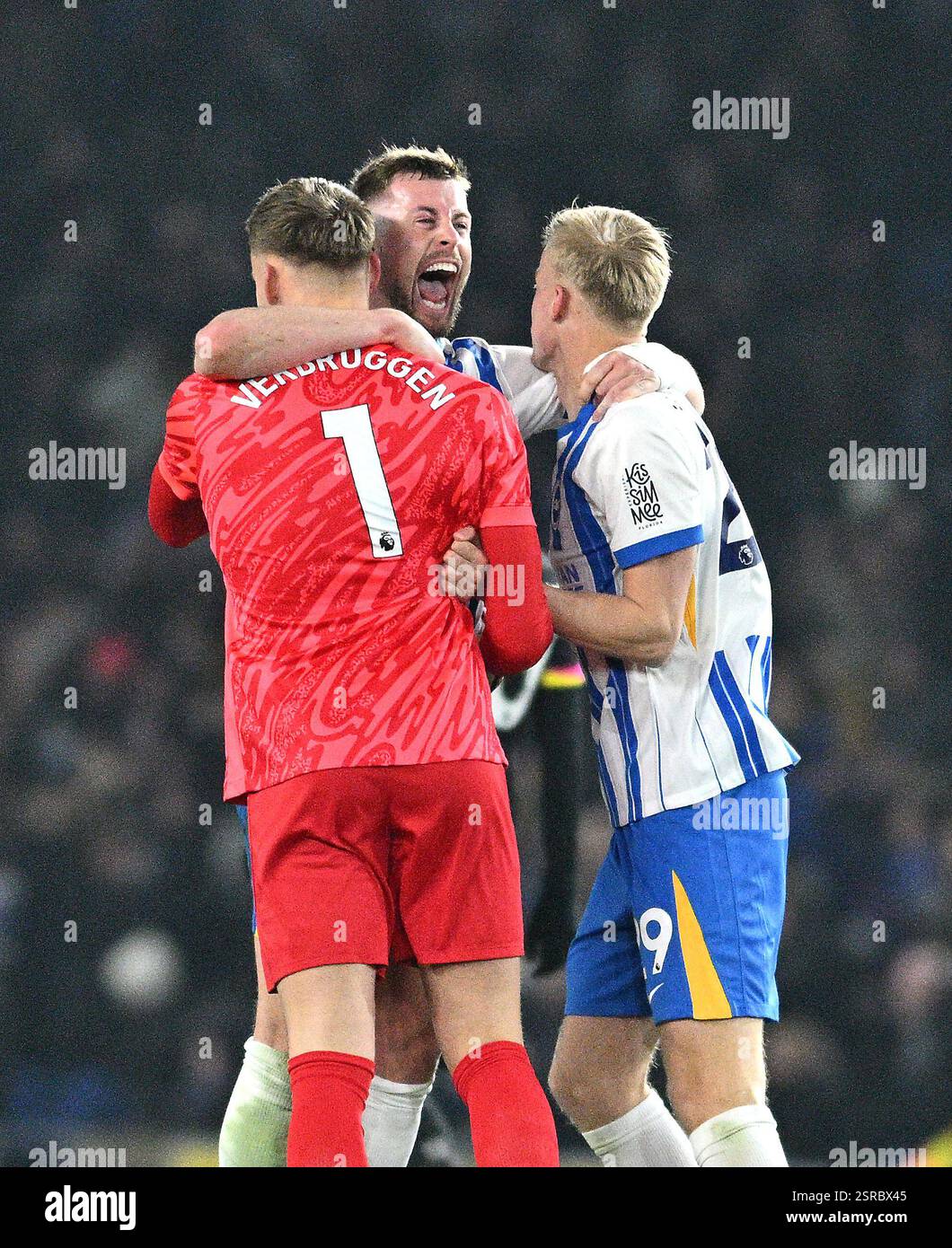 Adam Webster of Brighton celebrates with goalkeeper Bart Verbruggen and ...