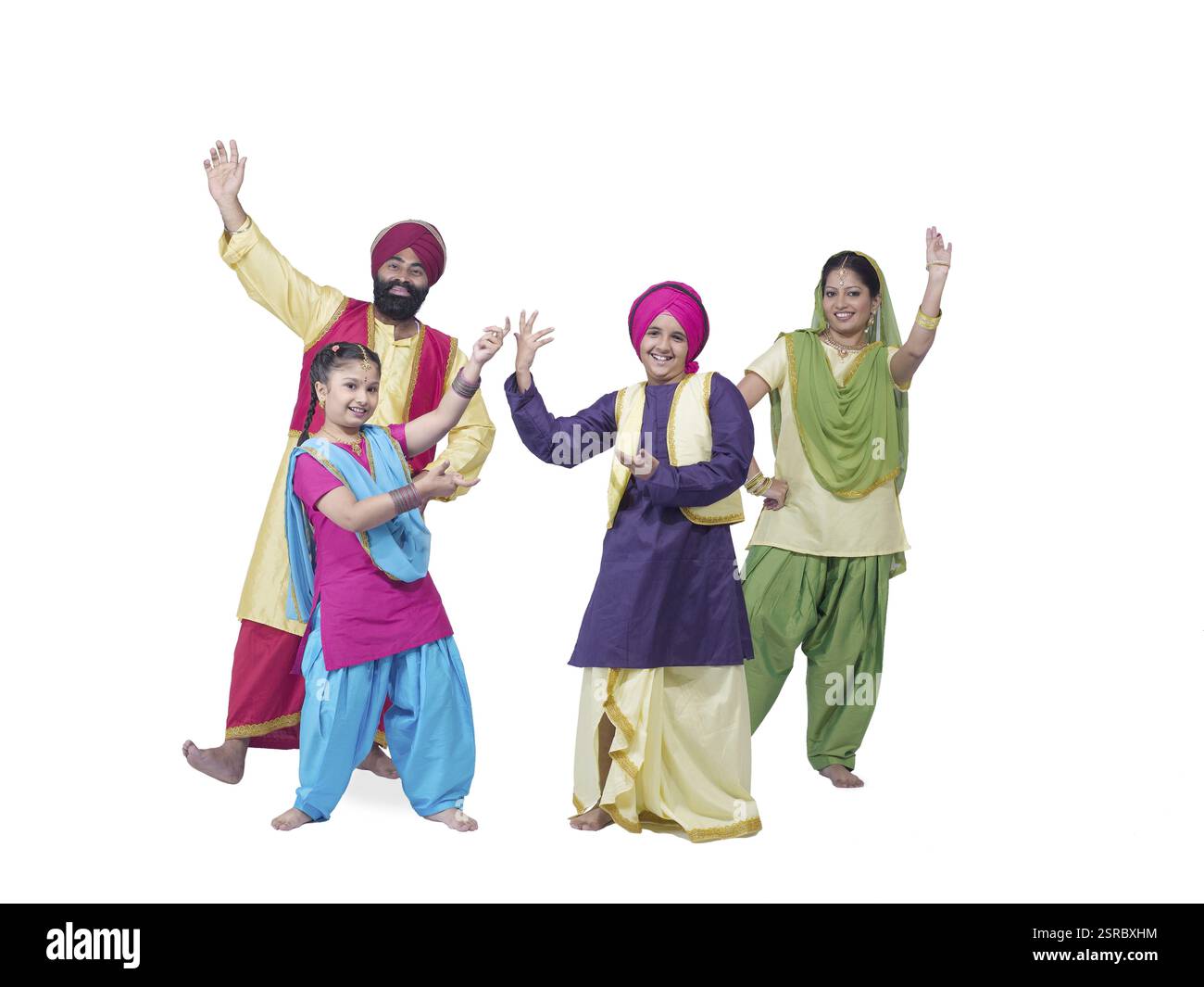 Sikh family performing folk dance bhangra MR#702X, 702Y, 702Z, 779A ...