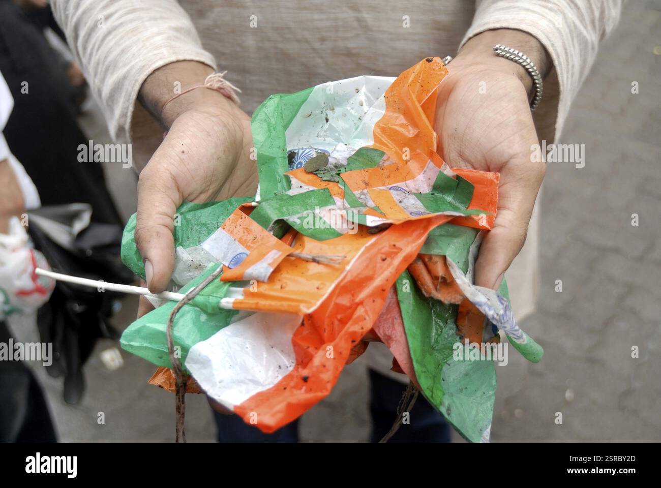 Hand showing thrown plastic Indian tri color flags, Bombay Mumbai ...