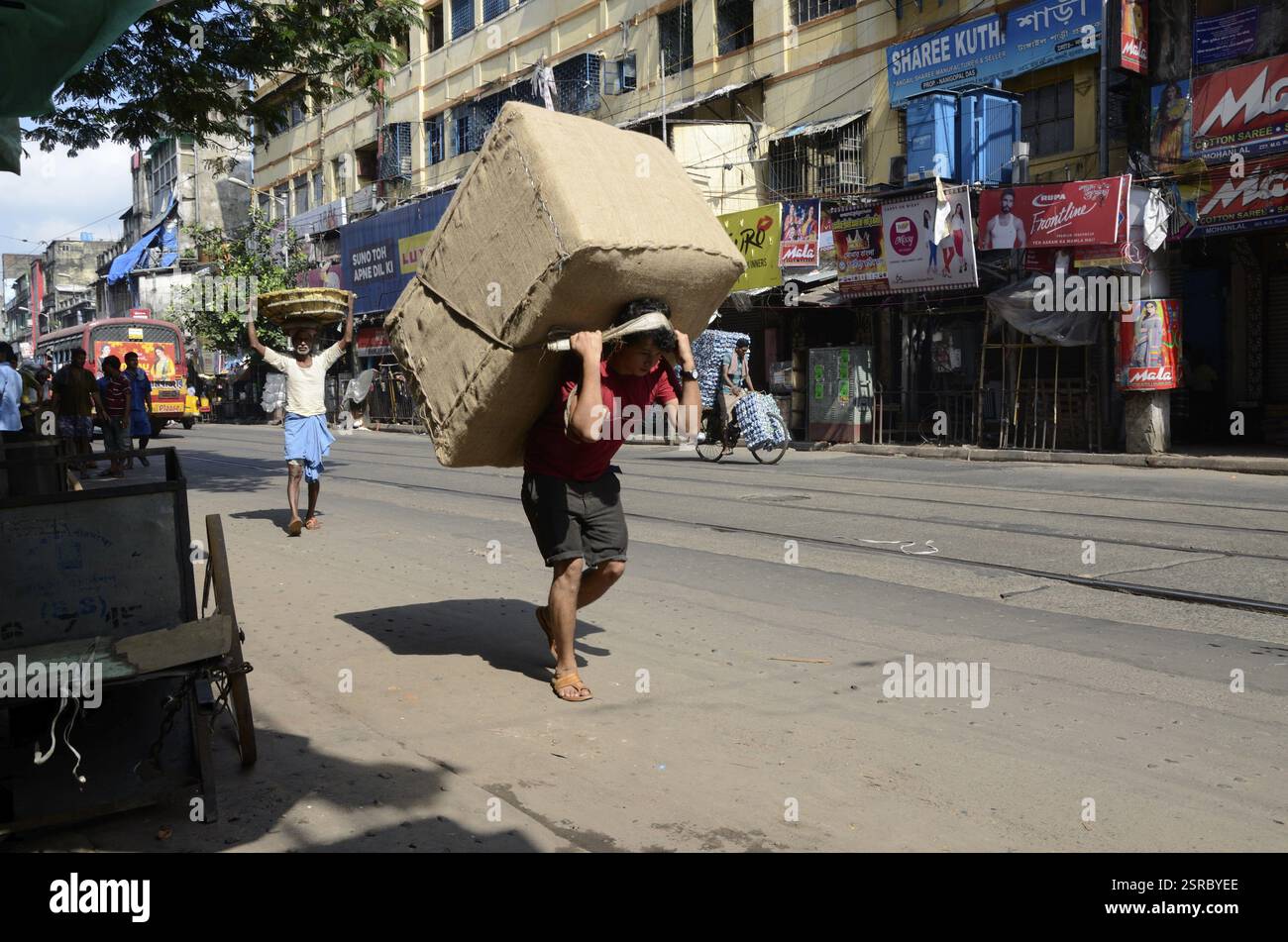 Man carrying big bags hi-res stock photography and images - Alamy
