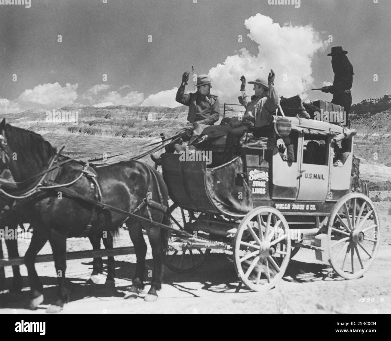 Black Bart, (Dan Duryea), makes a switch from his horse to the luggage ...