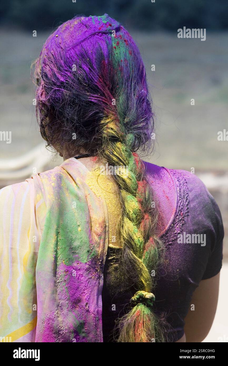 Close up of long platted hair lady celebrating holi holi festival ...