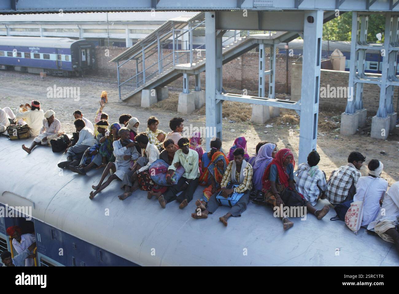 Pilgrims of Ramdevra fair sitting on roof of train, Jodhpur, Rajasthan ...