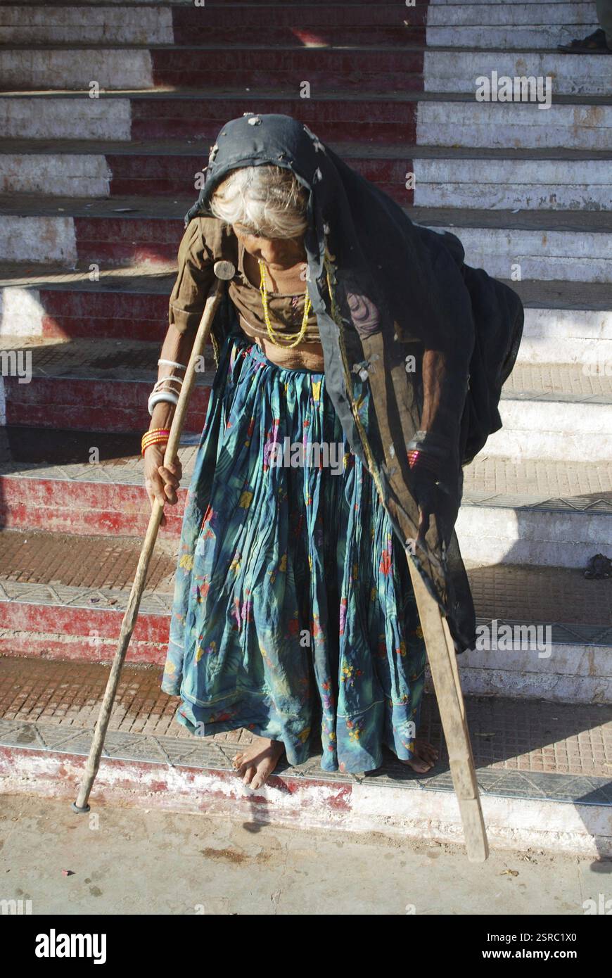 Old lady using crutches stepping down, Jodhpur, Rajasthan, India, Asia ...