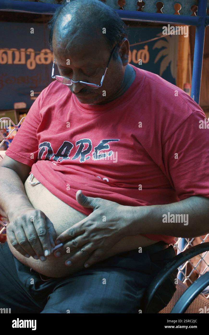 A diabetic patient injecting insulin injection, Alleppey, Kerala, India ...