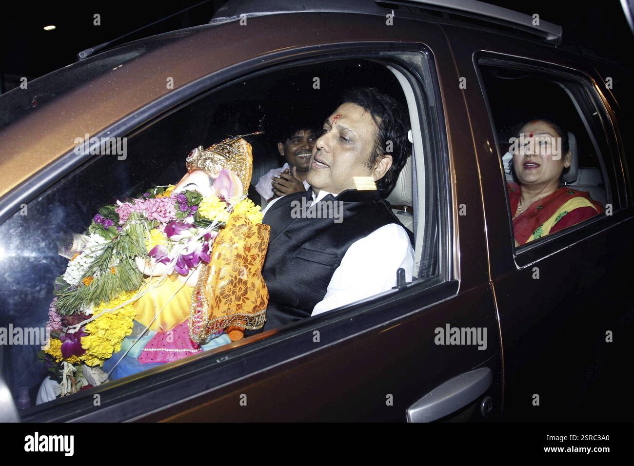 Bollywood actor Govinda participates in a procession for the immersion ...