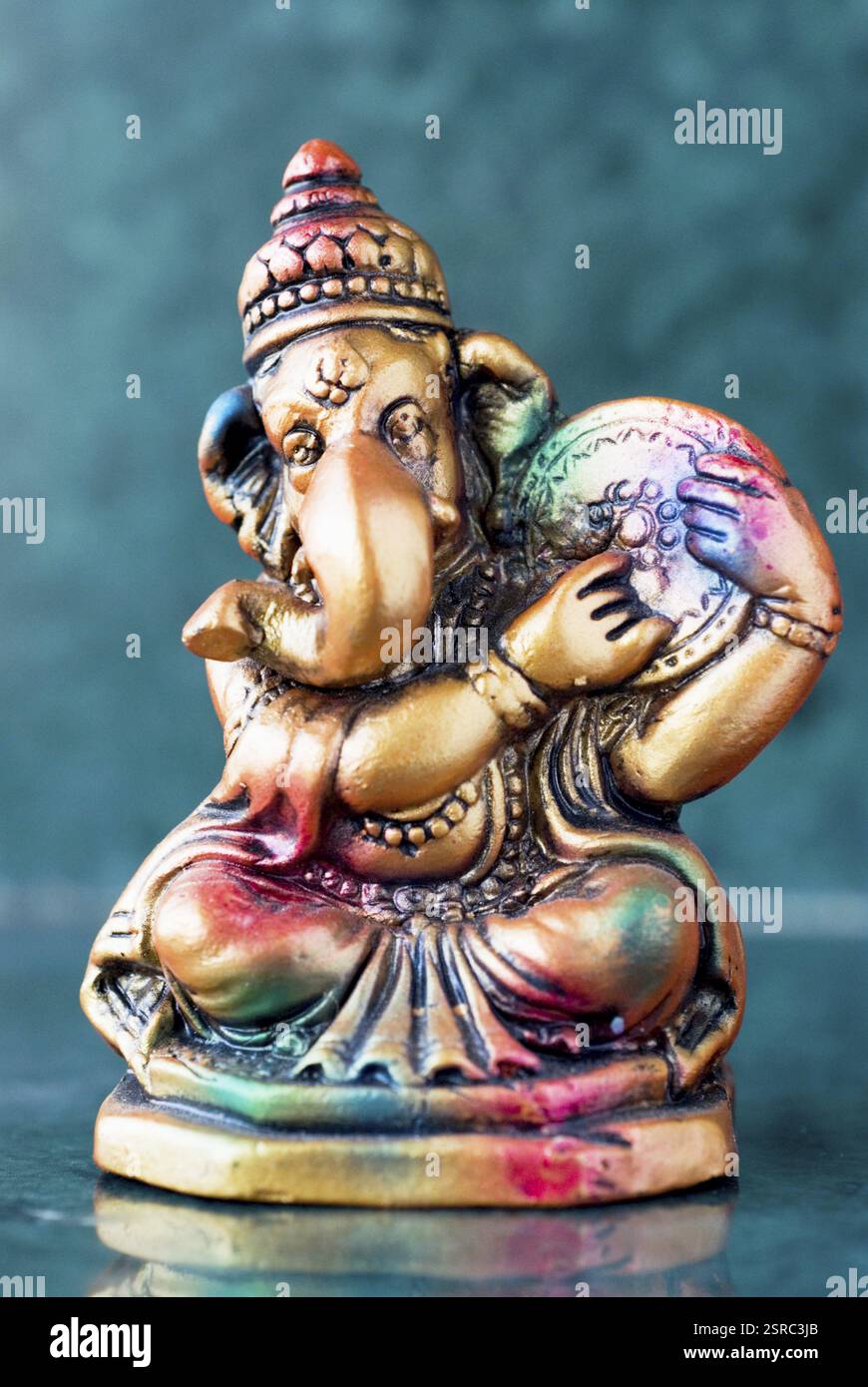 Lord Ganesha ganpati plaster Idol sitting colourful playing dafli hand ...
