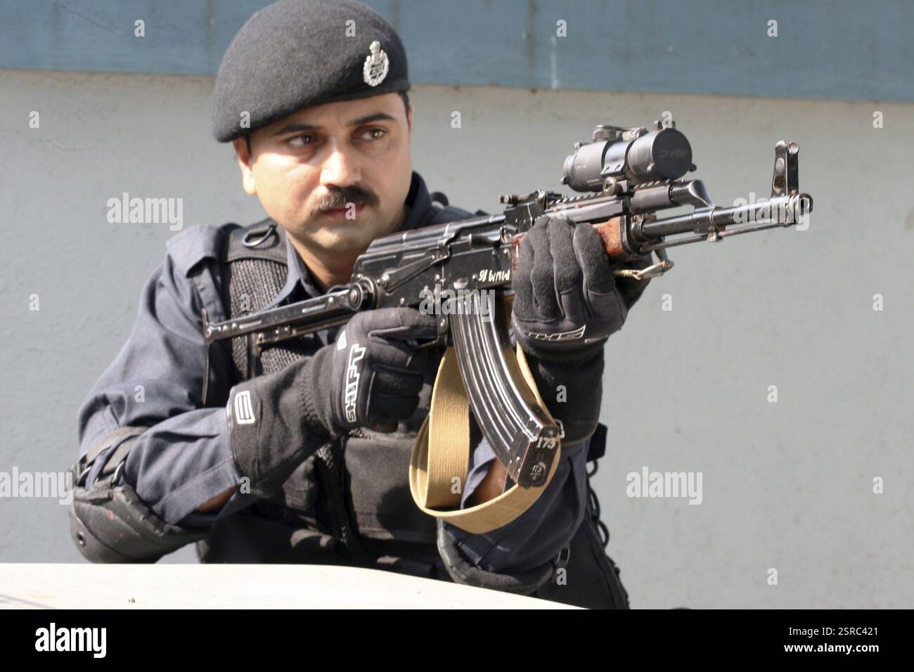 Black Cat commando with an AK 47 light machine gun MR#725 Stock Photo ...