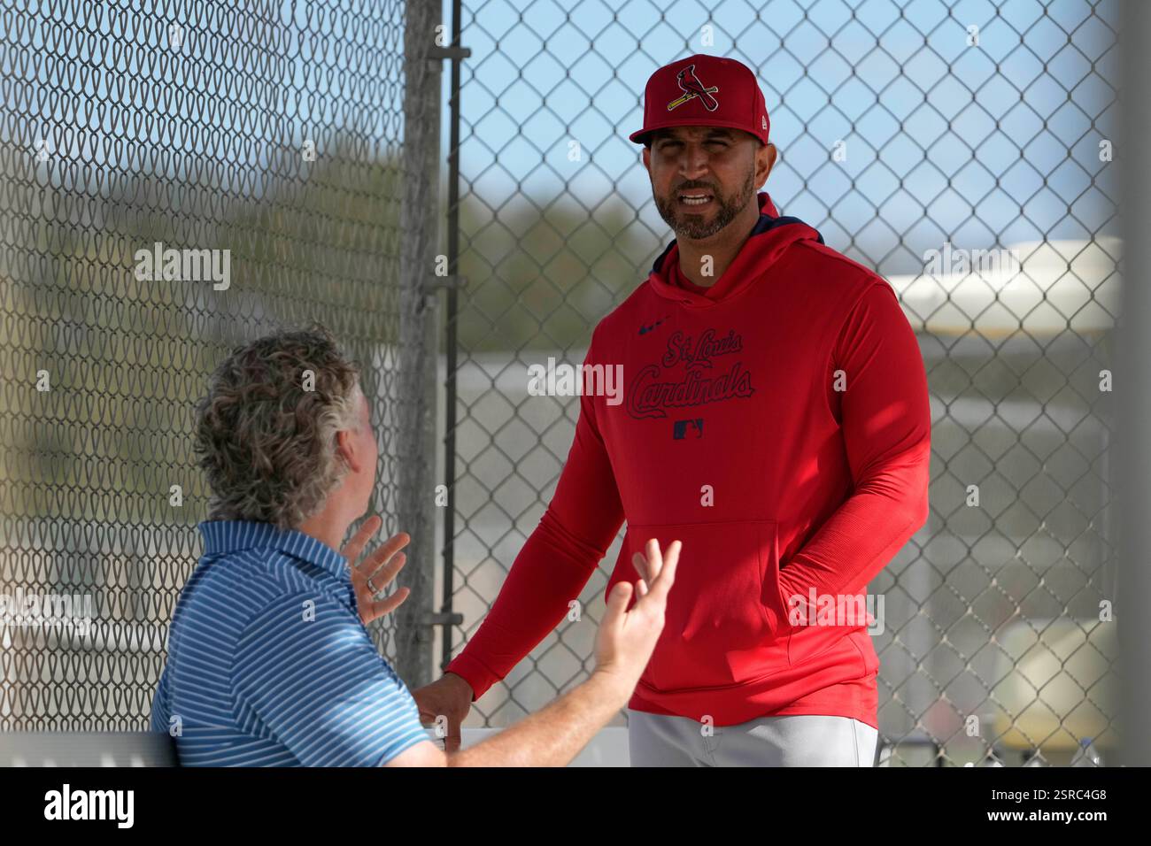 St. Louis Cardinals general manager Michael Girsch, left, talks with ...