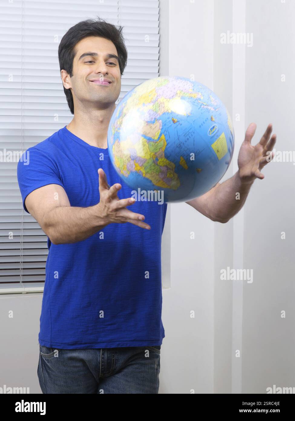 Man juggling with globe world, MR#779L Stock Photo - Alamy