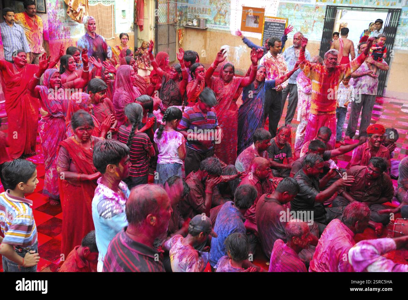 People playing with gulal on holi festival at Ghanshyam Ji temple ...