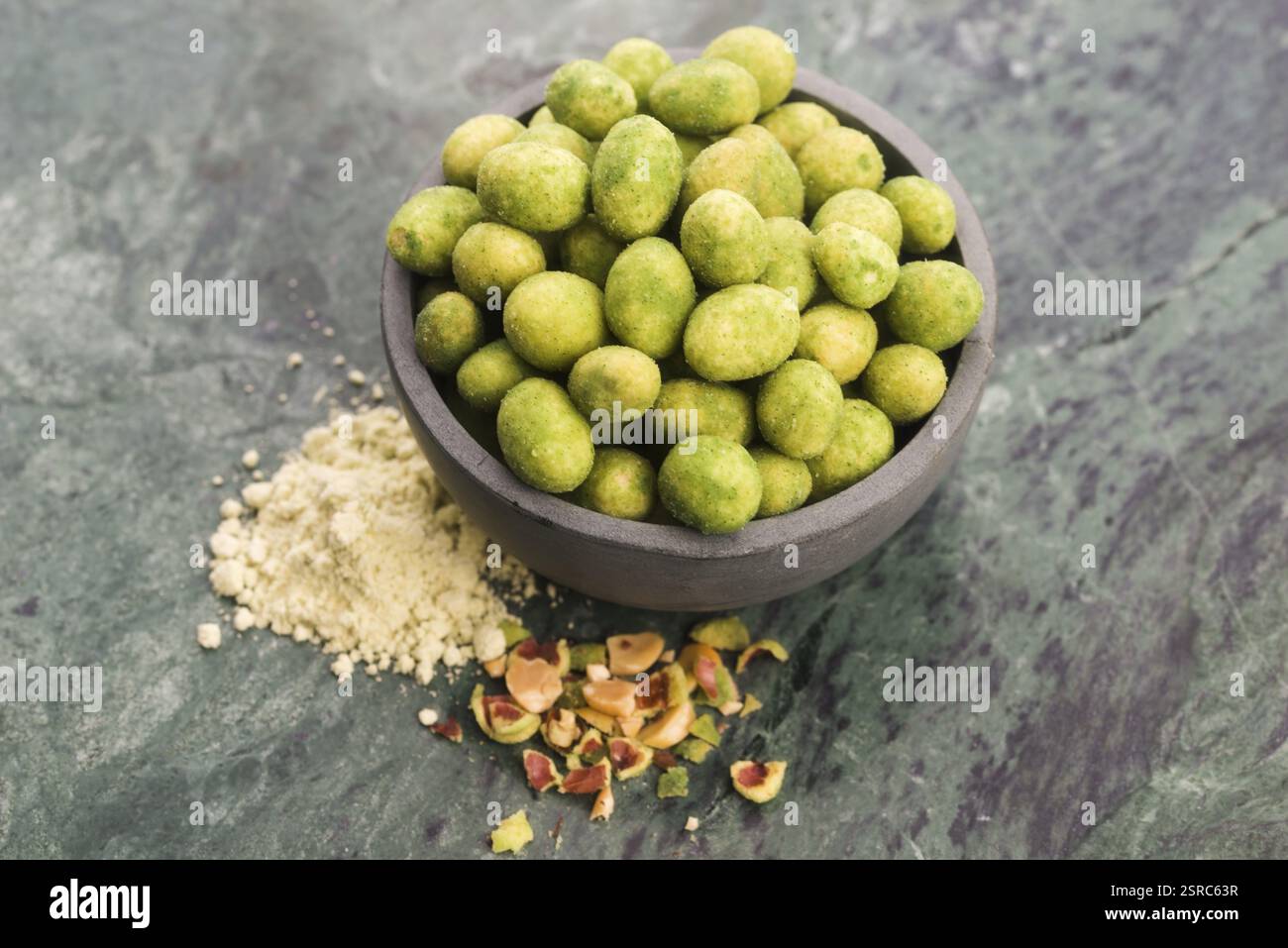 Pile of wasabi coated peanuts in bowl Stock Photo - Alamy