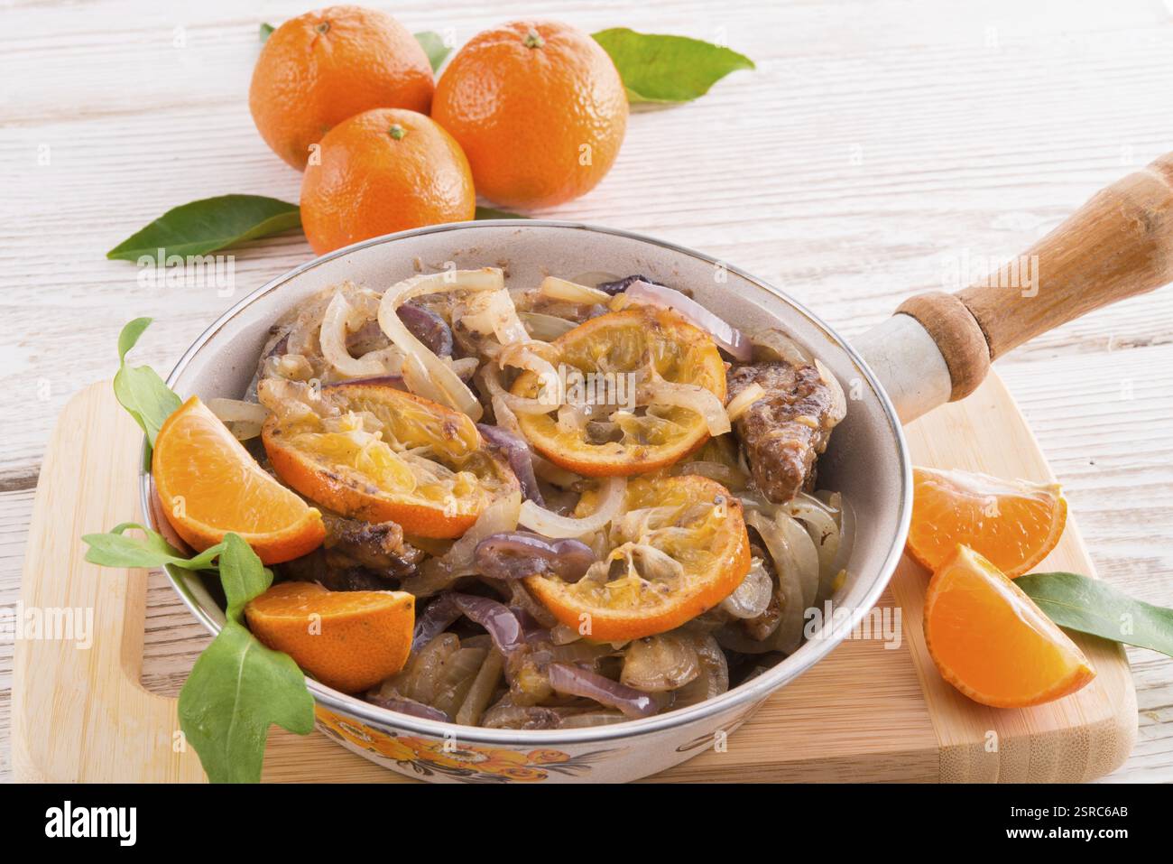 Liver with onion-orange sauce Stock Photo - Alamy