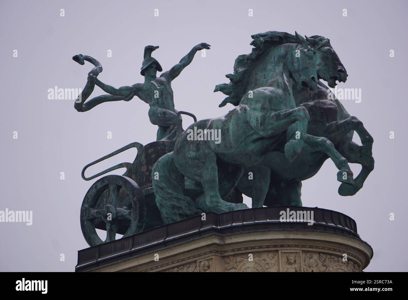 Close up of the statue of a Charioteer holding a snake on a chariot on ...