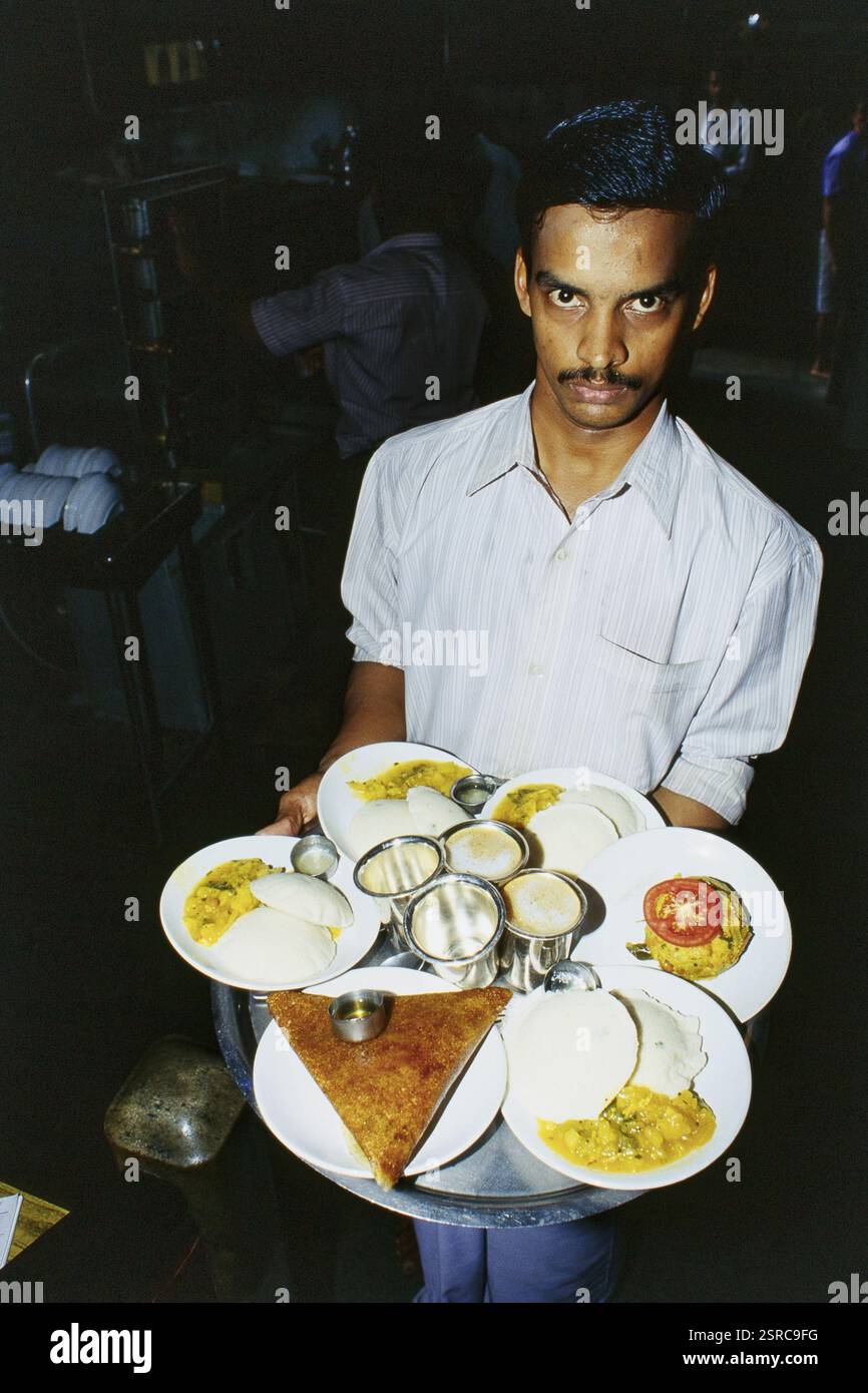 MTR restaurant waiter showing various dishes, Karnataka, India, Asia ...
