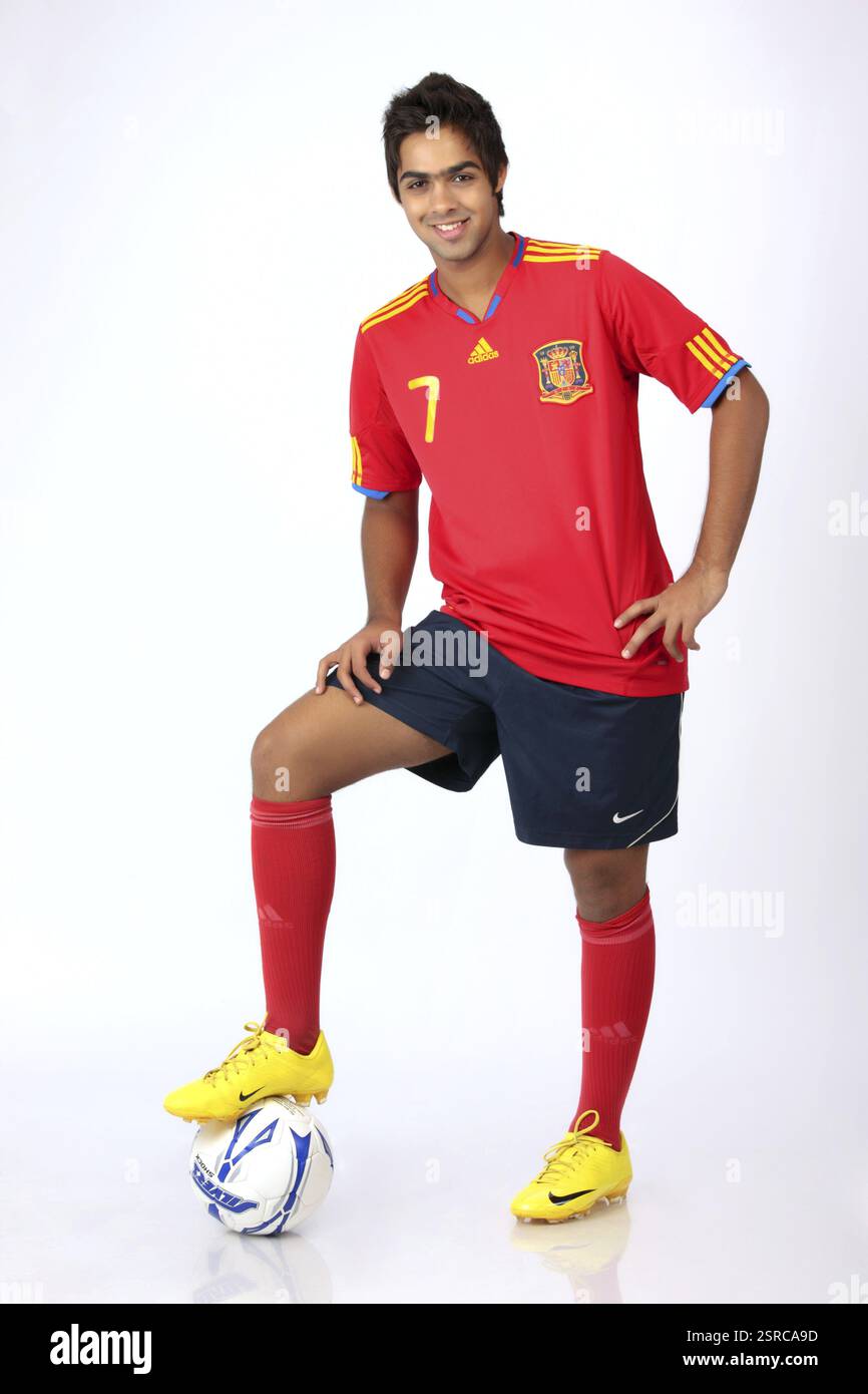 Portrait of a soccer player with ball, India MR#372 Stock Photo - Alamy