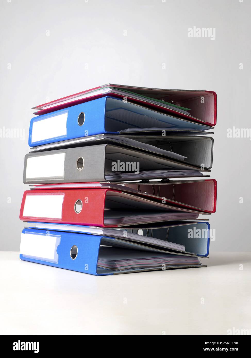 Stack of files on white background Stock Photo - Alamy